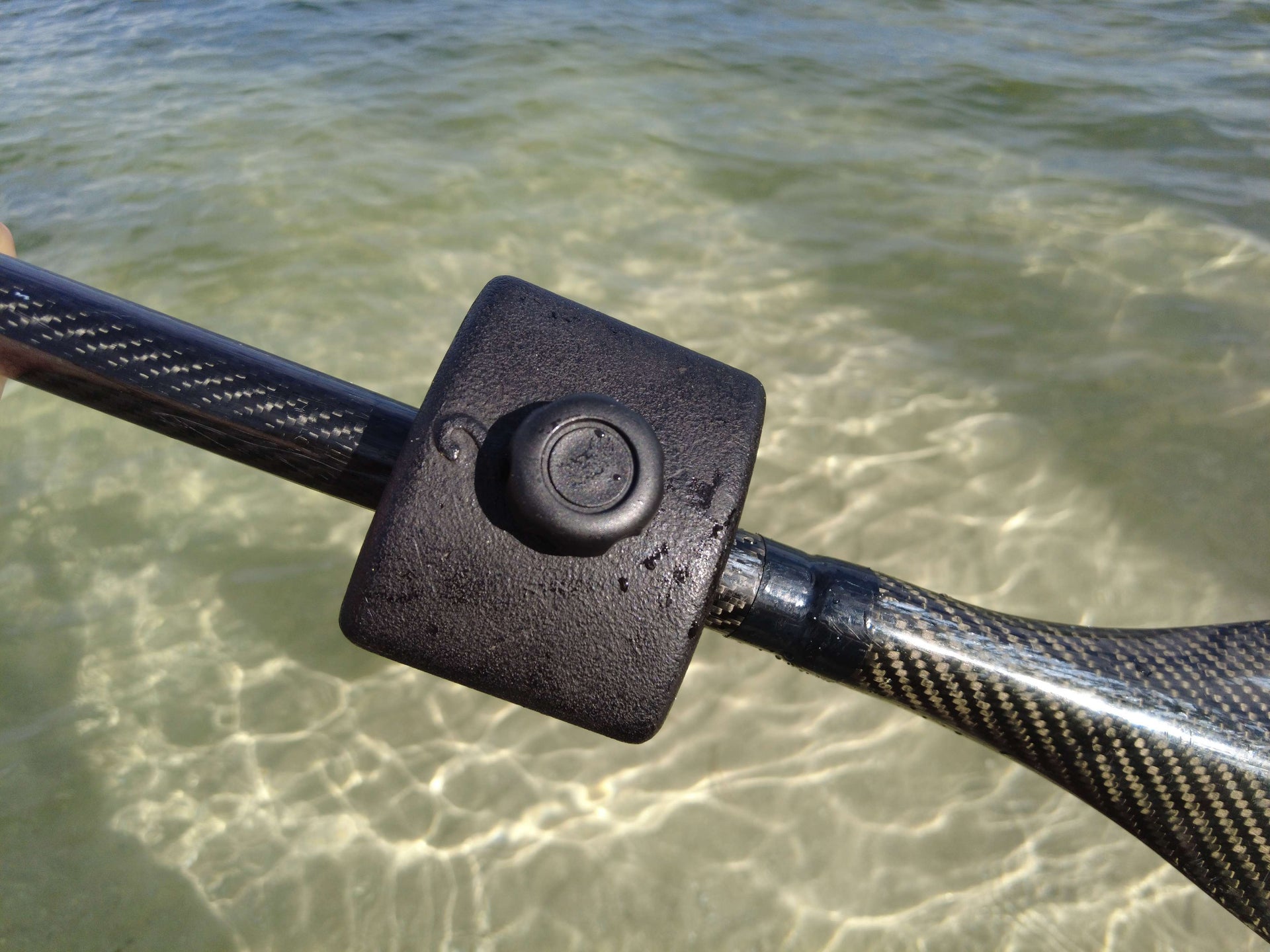 The Paddle Bracket mounts to the shaft of a SUP paddle.